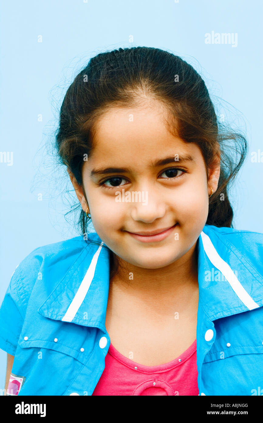 Portrait of a girl grinning Stock Photo - Alamy