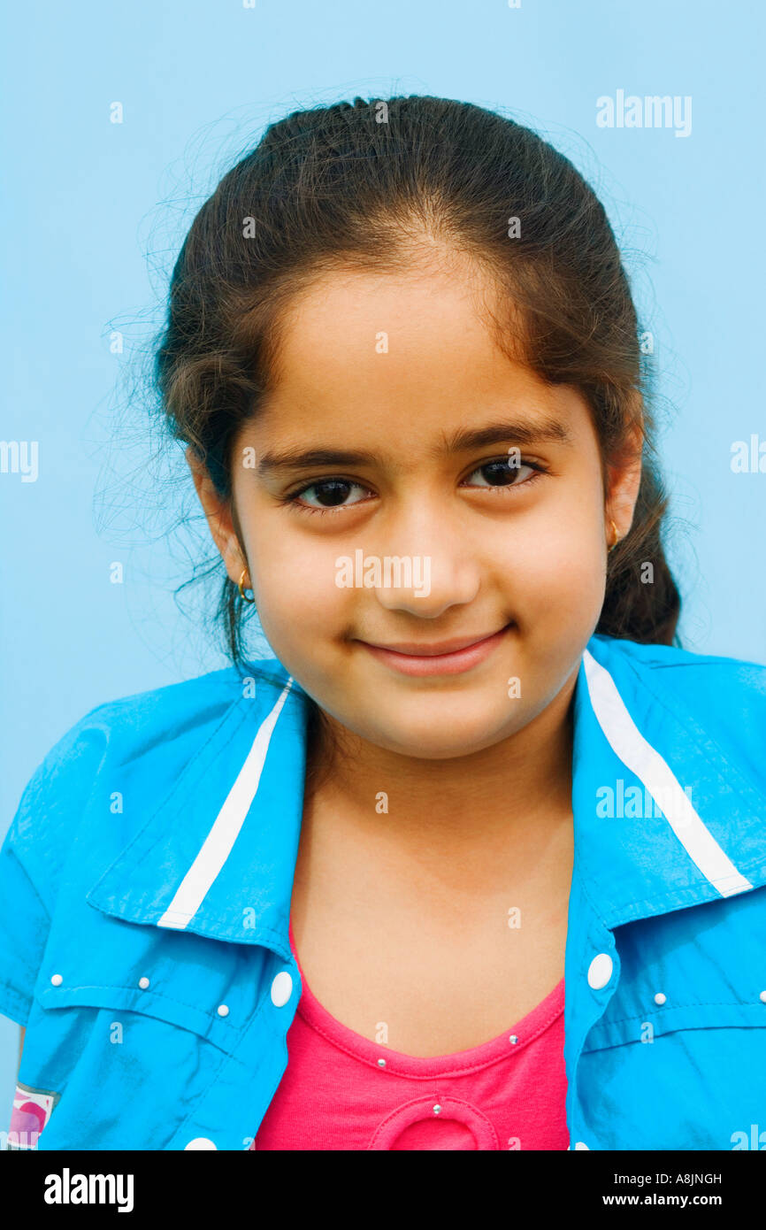 Portrait of a girl grinning Stock Photo - Alamy