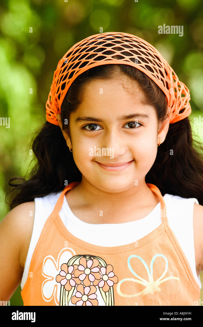 Portrait of a girl smirking Stock Photo - Alamy