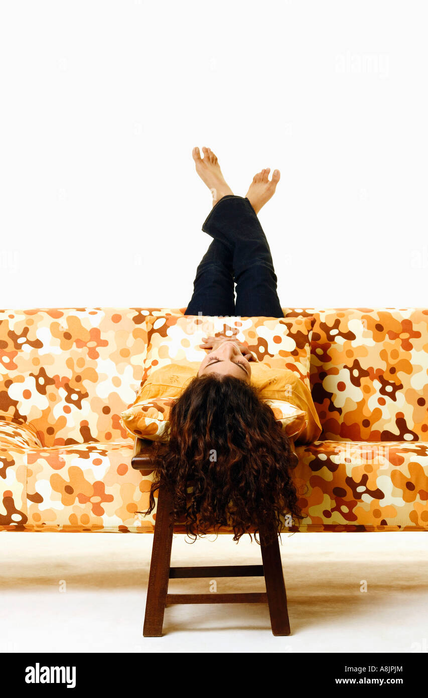 Woman barefoot legs up couch hi-res stock photography and images - Alamy