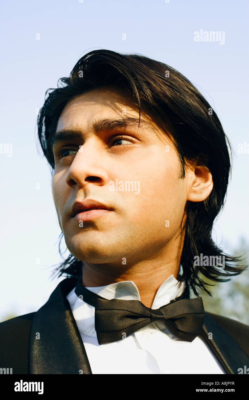 Close-up of a young man looking serious Stock Photo - Alamy