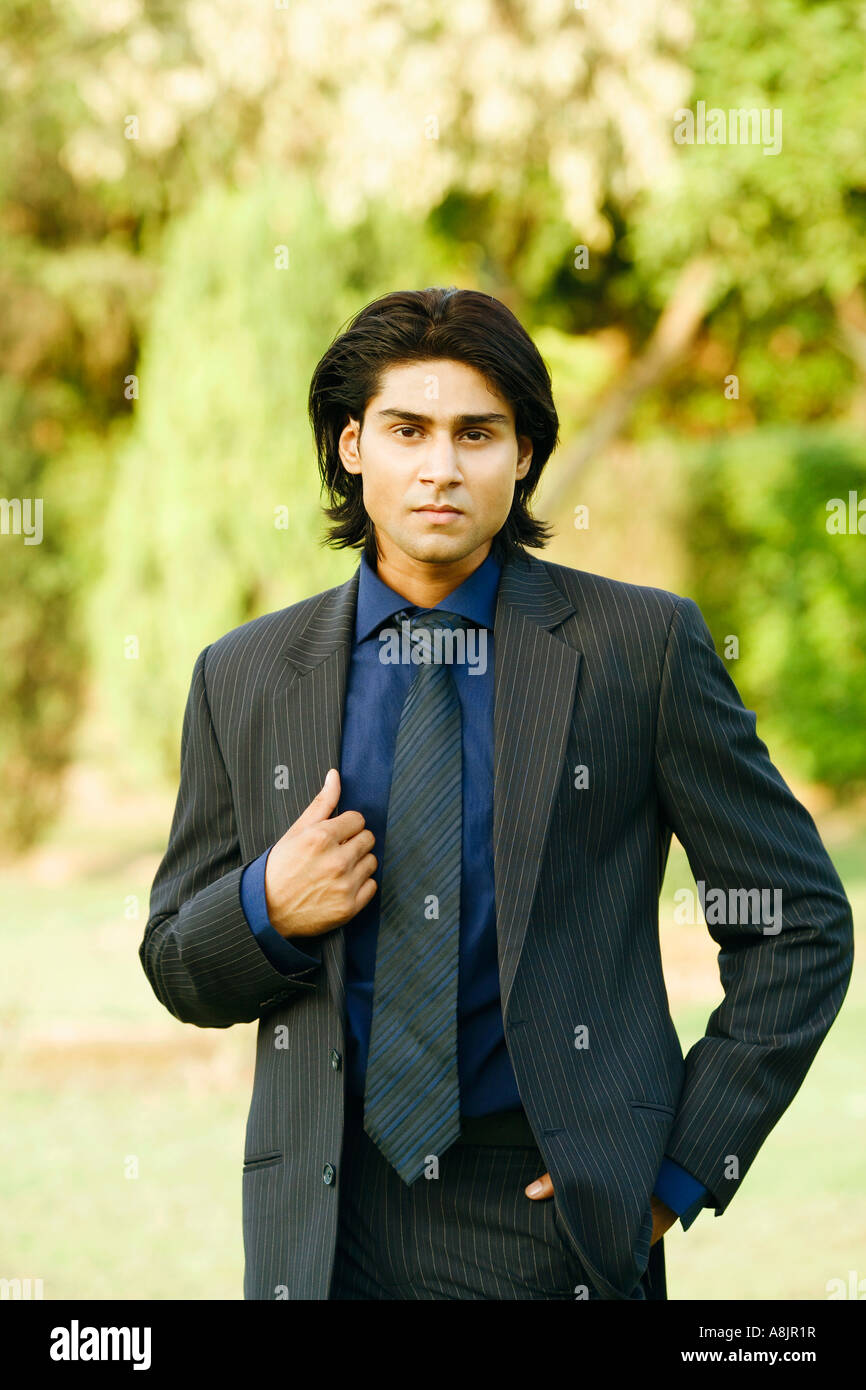 Portrait of a young man looking serious Stock Photo - Alamy