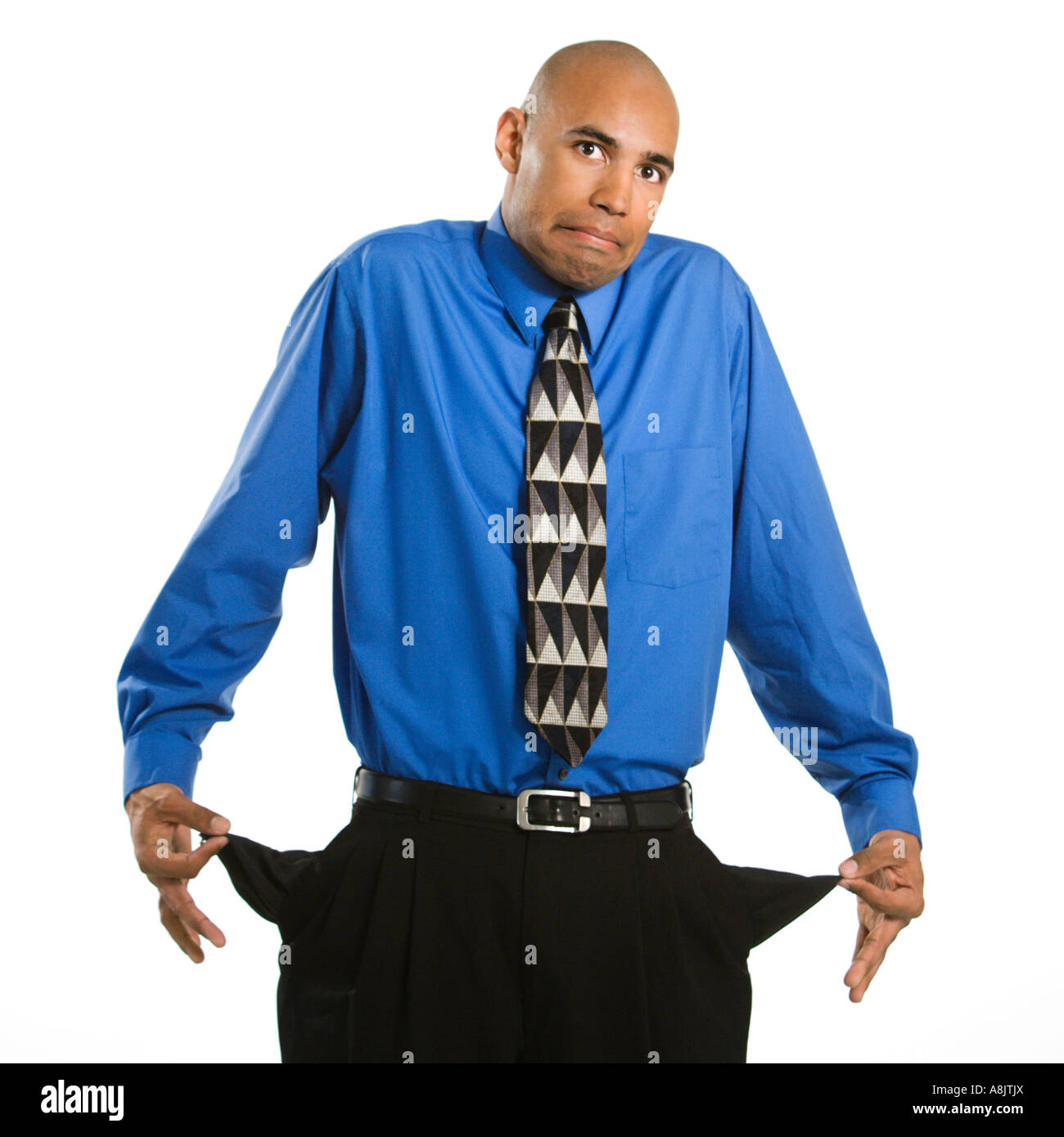 African American man in suit pulling out empty pockets and shrugging ...