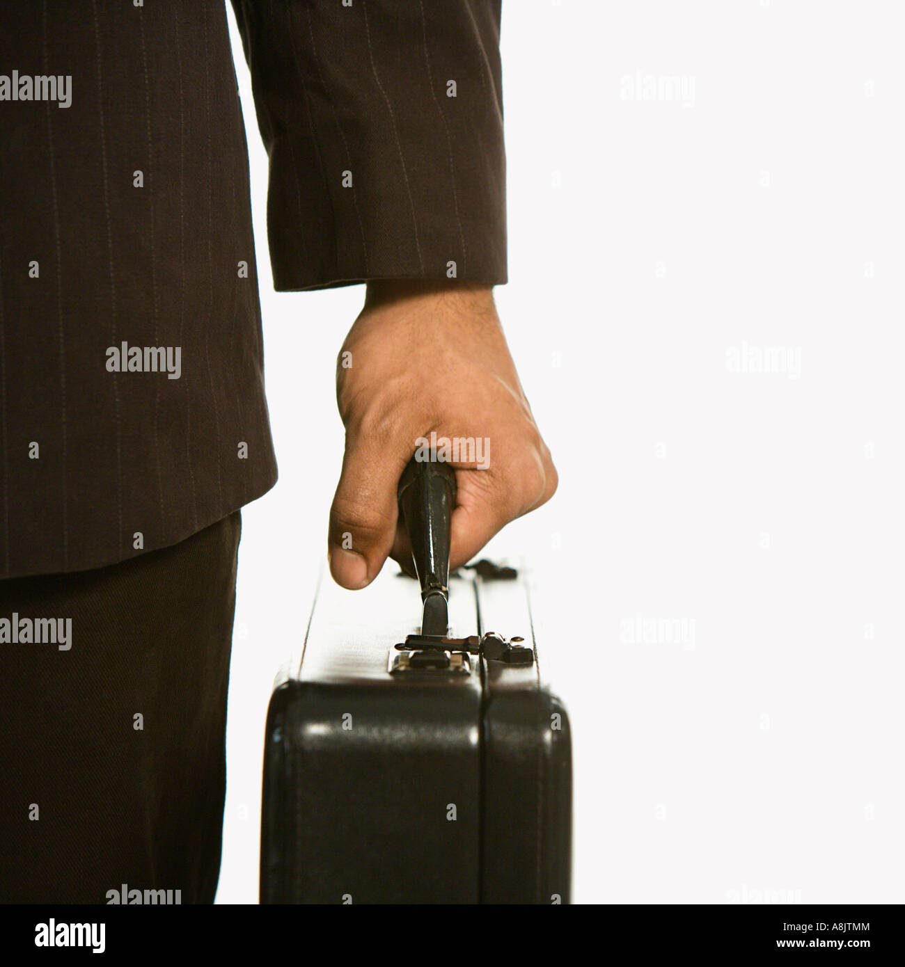 African American businessman in suit holding briefcase Stock Photo - Alamy