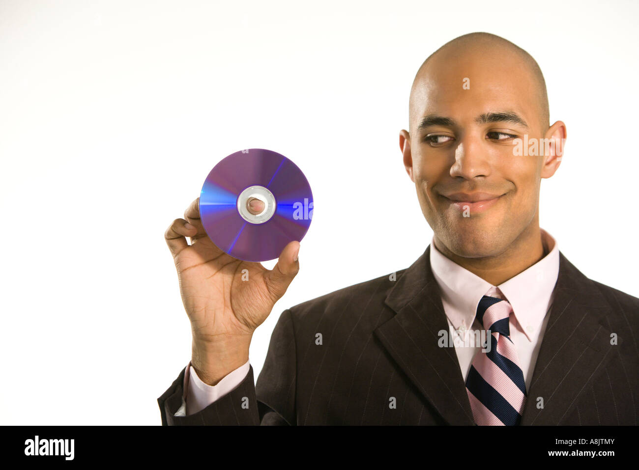 African American man smiling holding out compact disc Stock Photo - Alamy