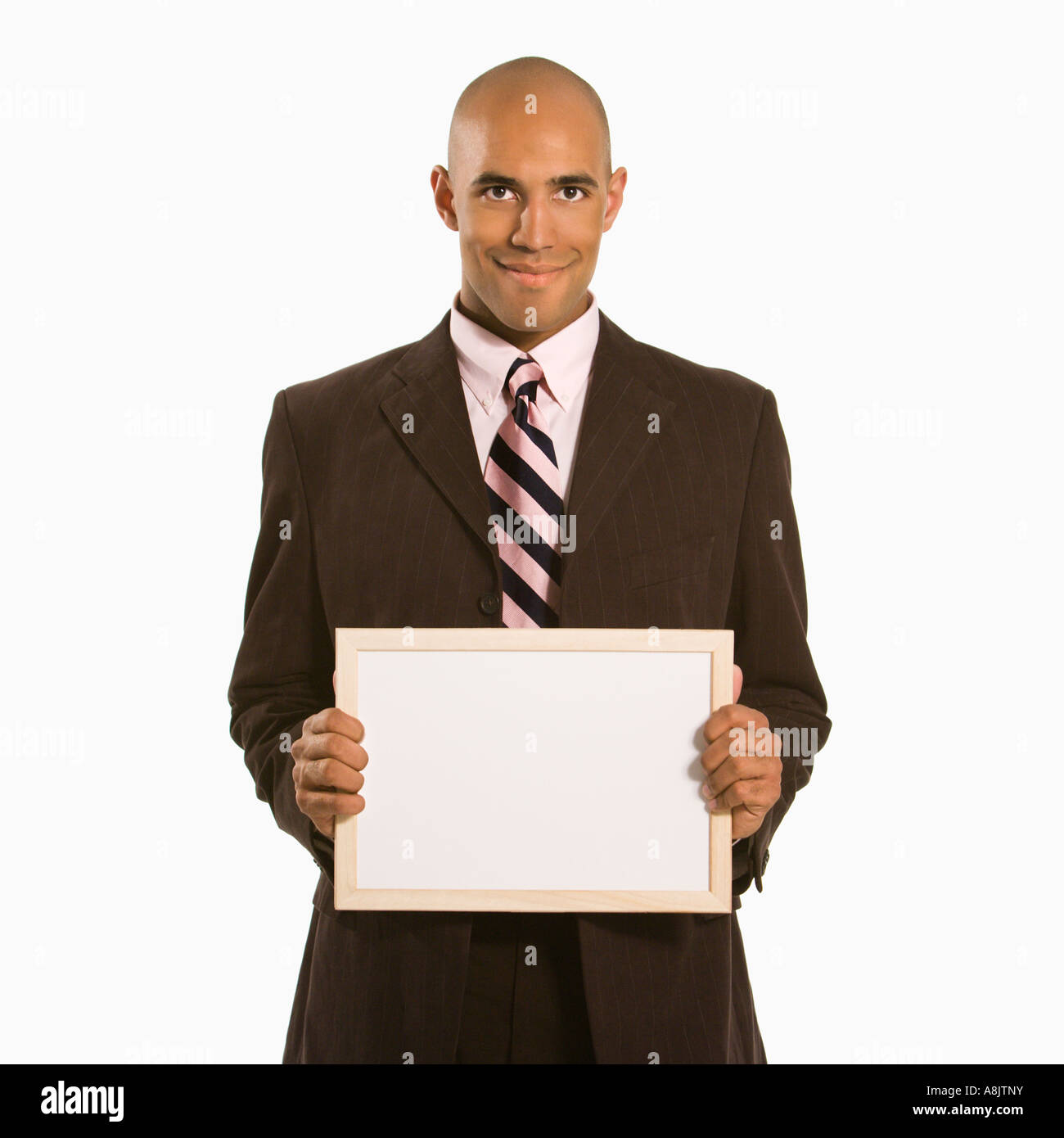 African American man holding blank sign standing against white ...