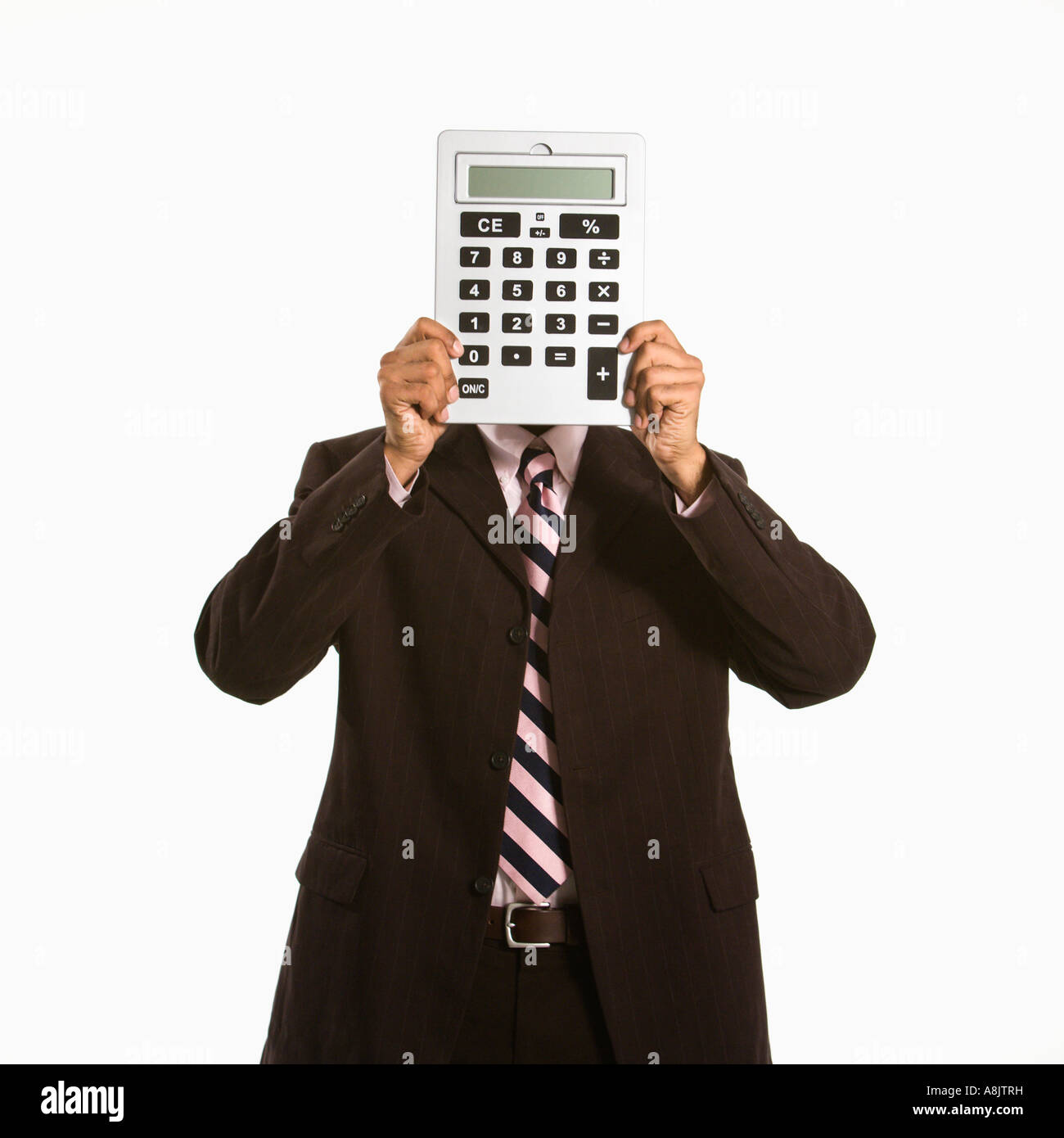 African American man holding oversized calculator over his face Stock ...