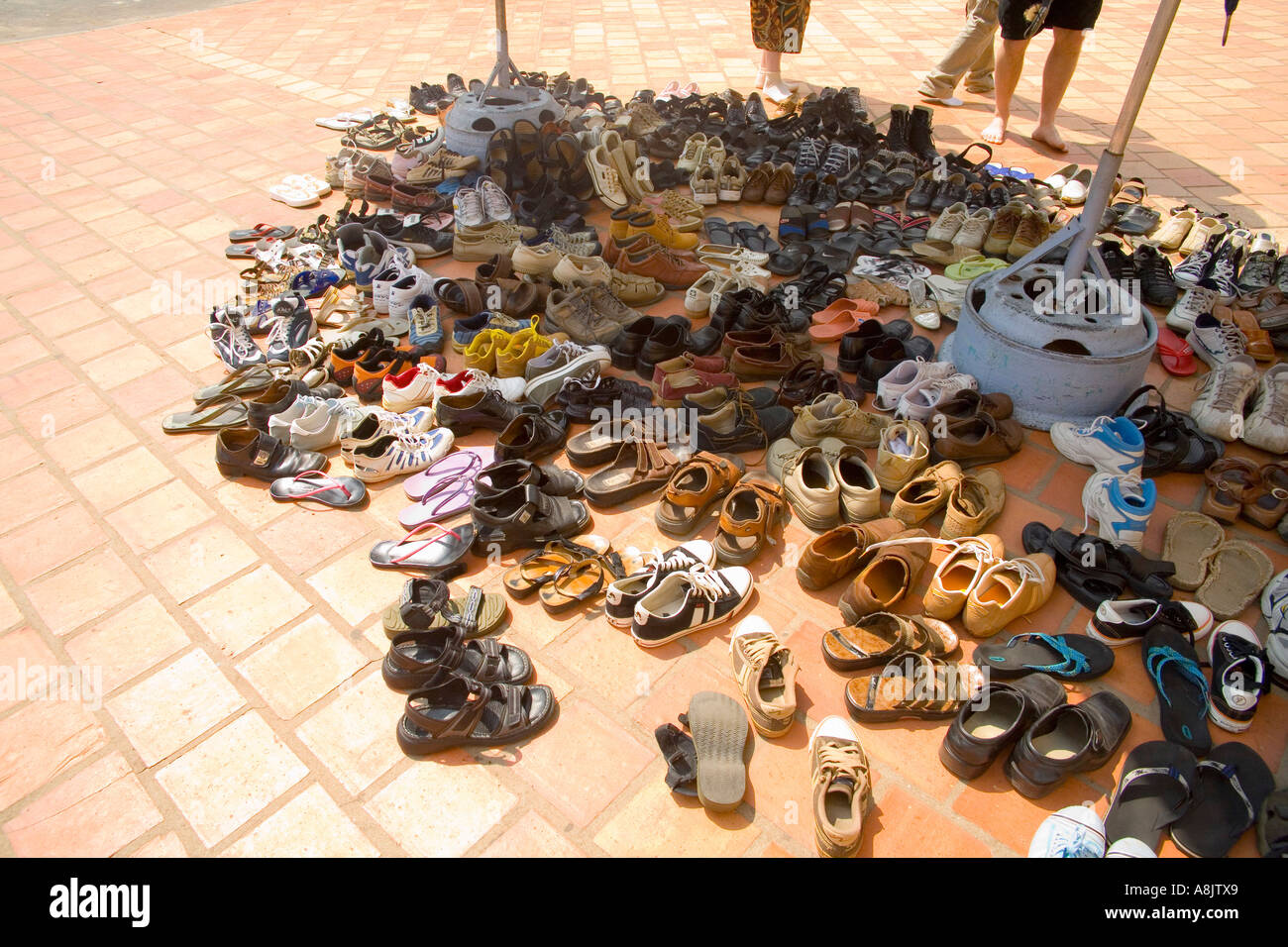 Shoes on bricks outside Vietnamese temple Stock Photo - Alamy