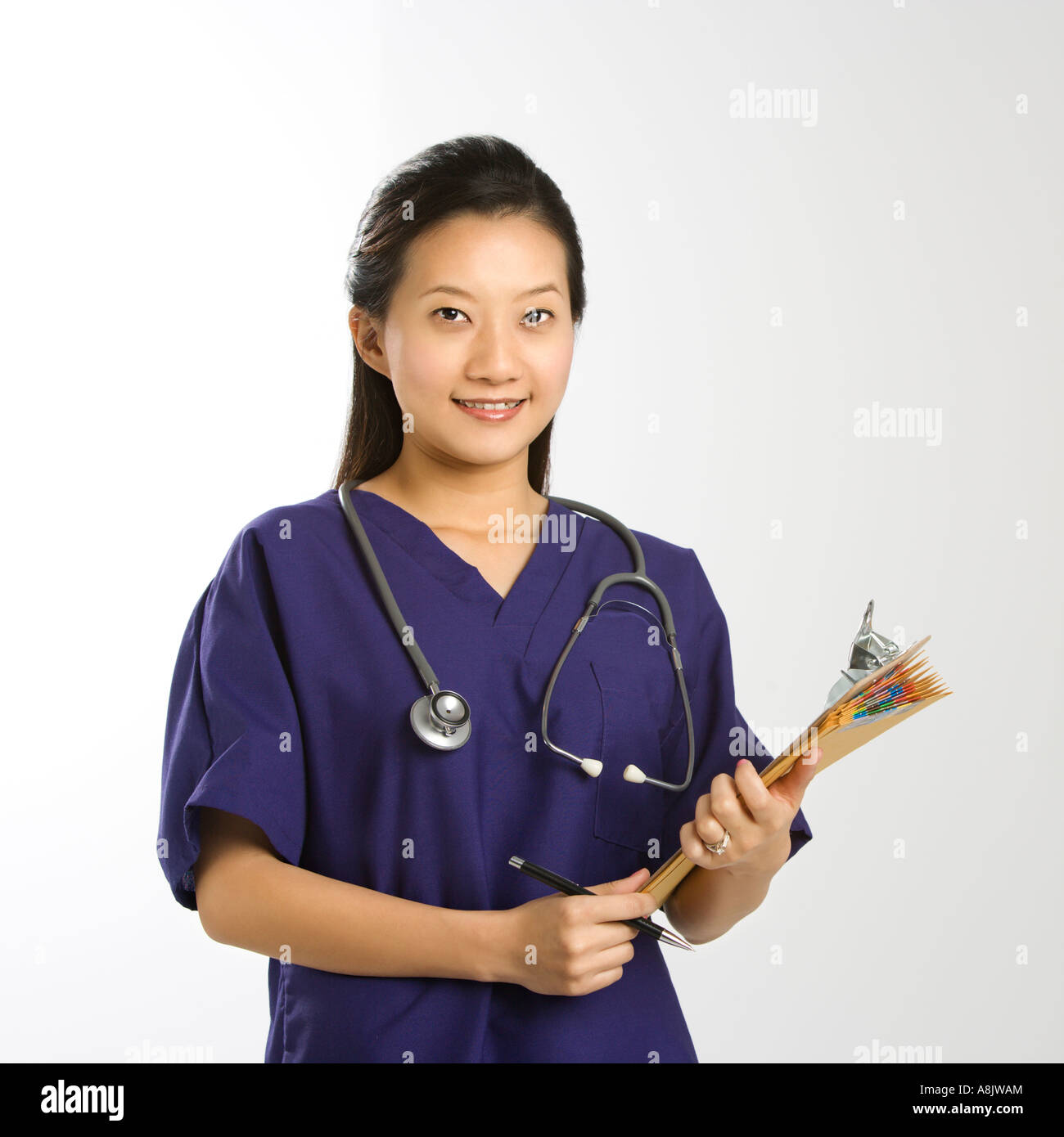 Portrait of Asian Chinese mid adult female doctor smiling and looking ...