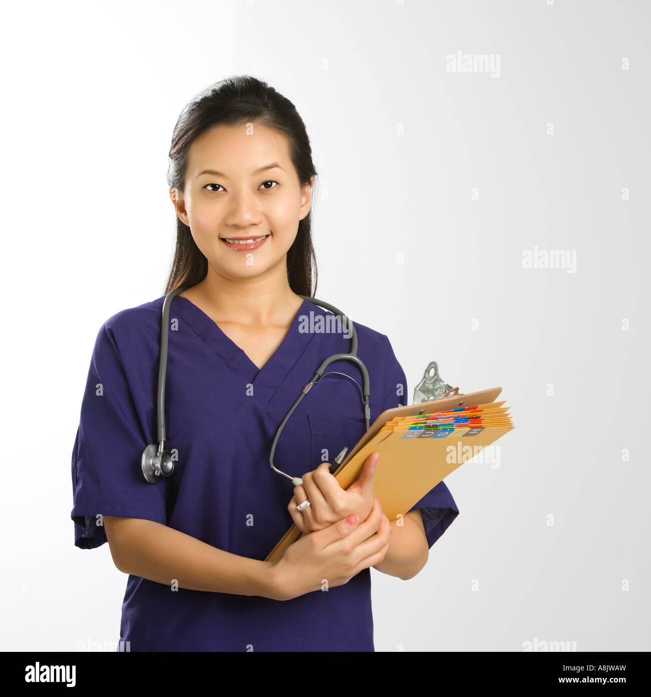Portrait of Asian Chinese mid adult female doctor smiling and looking ...