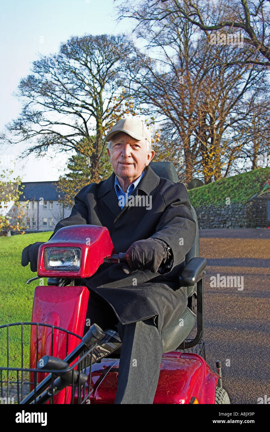 Disabled Man on Scooter Newport Stock Photo - Alamy