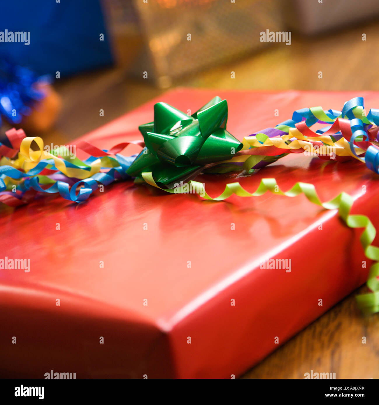 Presents wrapped and decorated with bows on a table Stock Photo - Alamy
