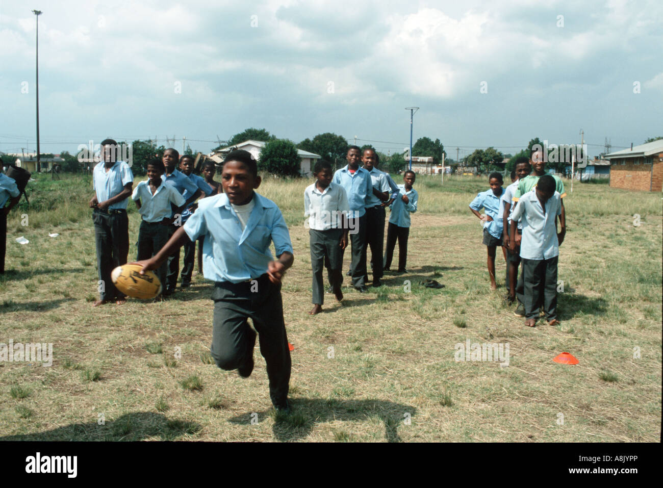 SOUTH AFRICA BOYS PLAYING RUGBY TENBISA TOWNSHIP JO BURG Photo Julio ...