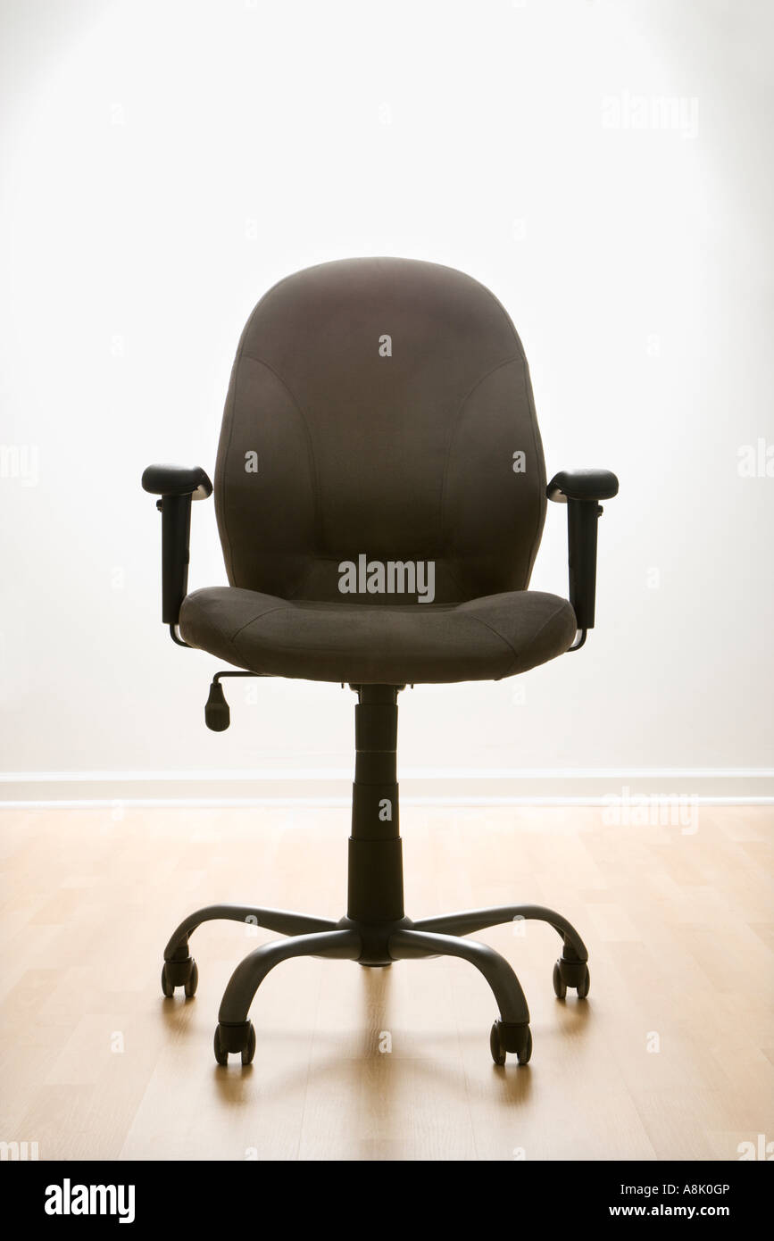 Still life of empty office desk chair Stock Photo - Alamy
