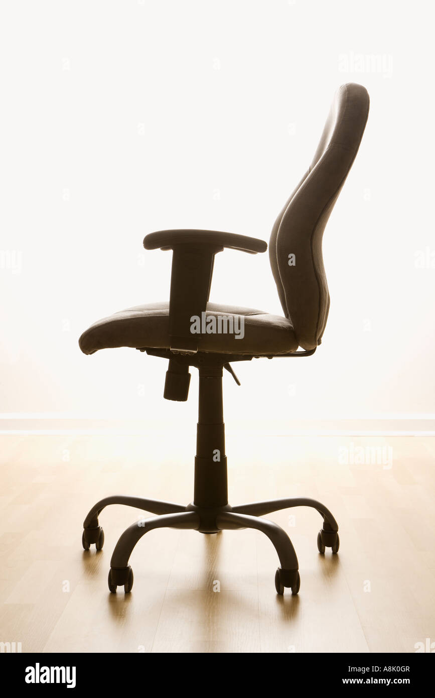 Still life of empty office desk chair Stock Photo - Alamy