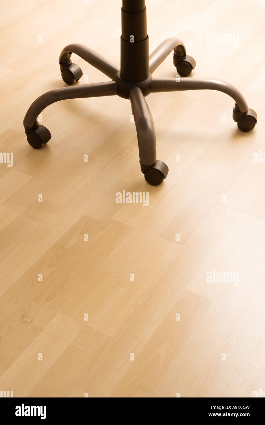 Still life of legs and wheels of office desk chair Stock Photo - Alamy