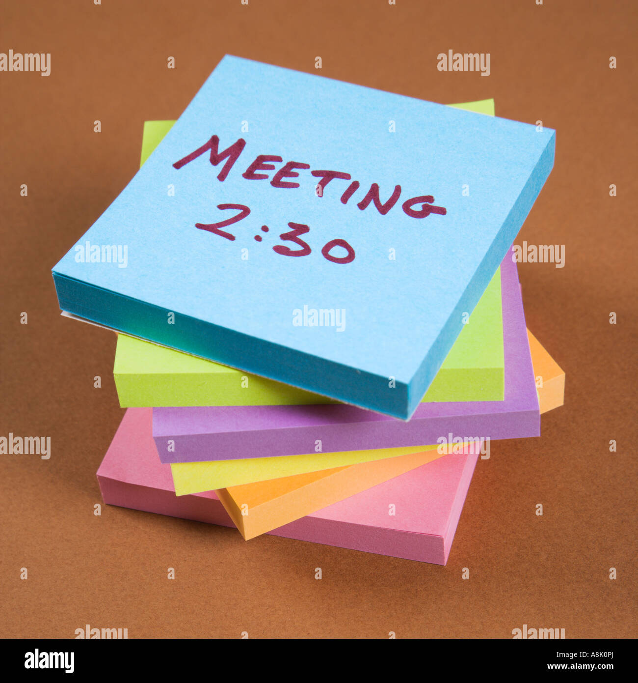 Stack of sticky notes with a meeting reminder Stock Photo - Alamy