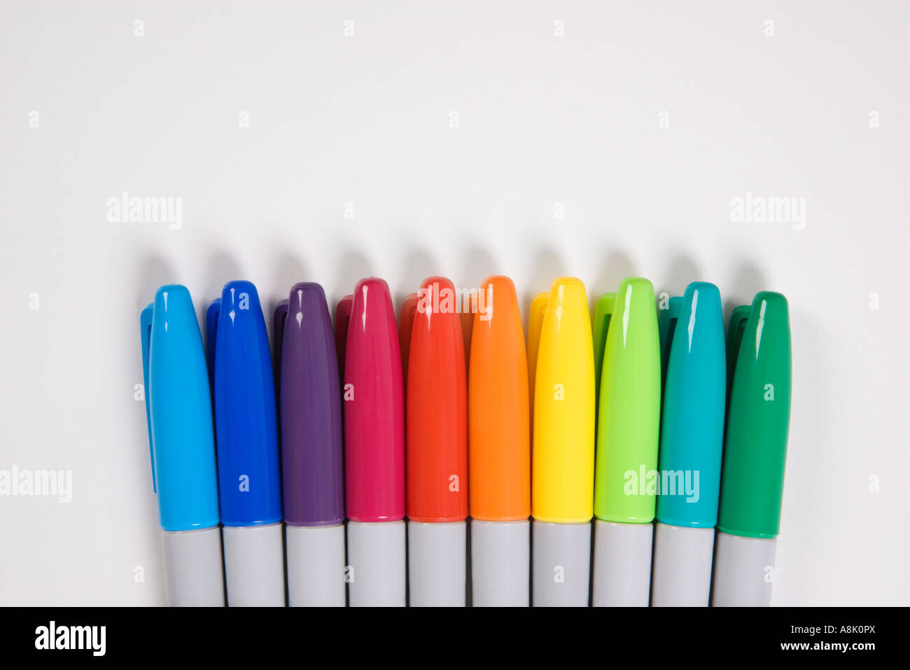 Group of colorful markers lined up in a row Stock Photo - Alamy