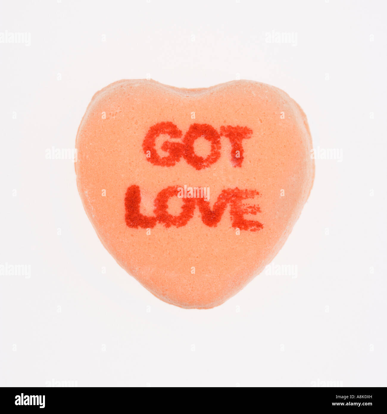 Orange candy heart that reads got love against white background Stock ...