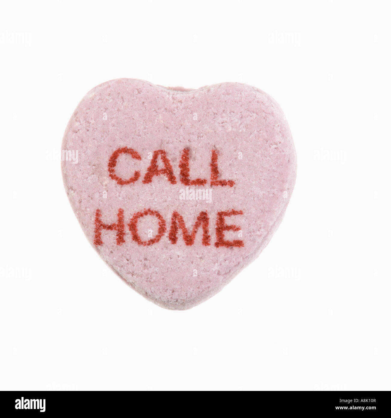 Purple candy heart that reads call home against white background Stock ...