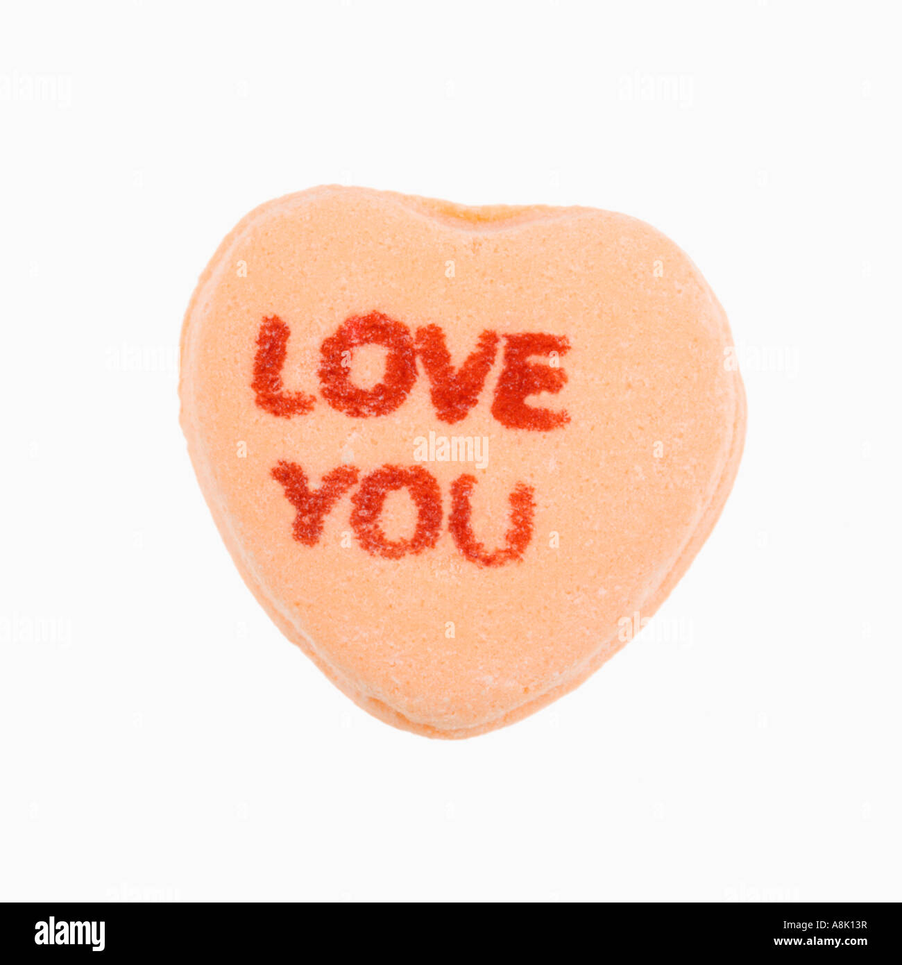 Orange candy heart that reads love you against white background Stock ...