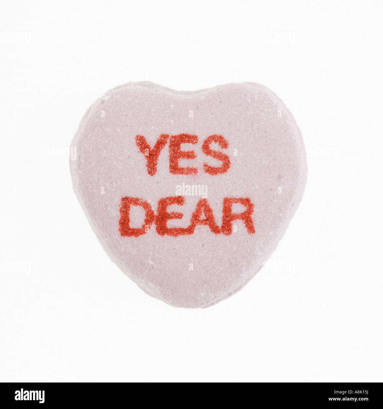 Purple candy heart that reads yes dear against white background Stock ...
