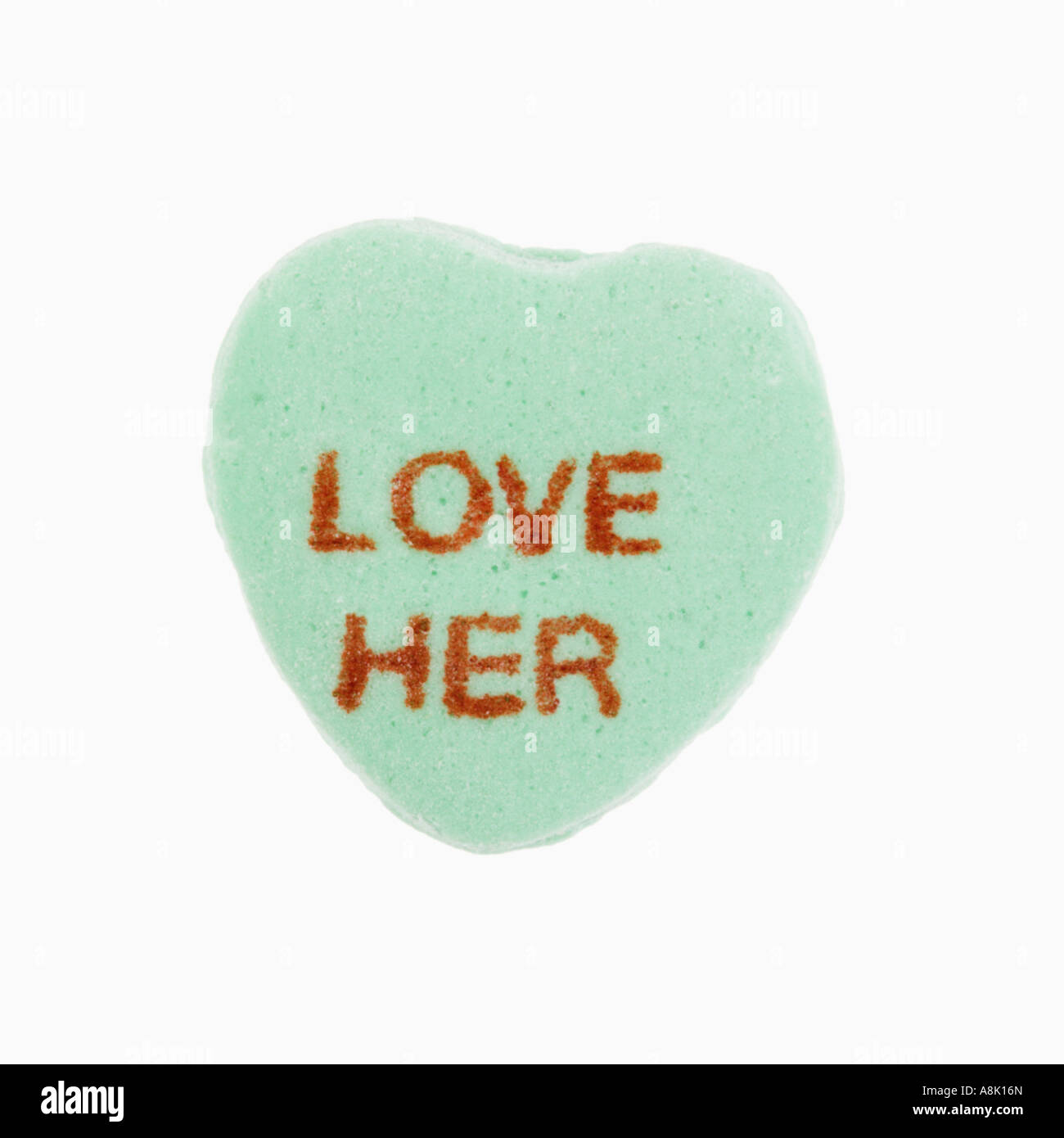 Green candy heart that reads love her against white background Stock ...