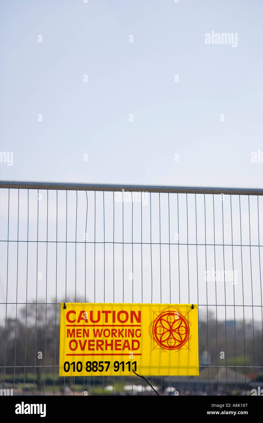 Caution Sign on Wire Fence on Site UK London Stock Photo - Alamy