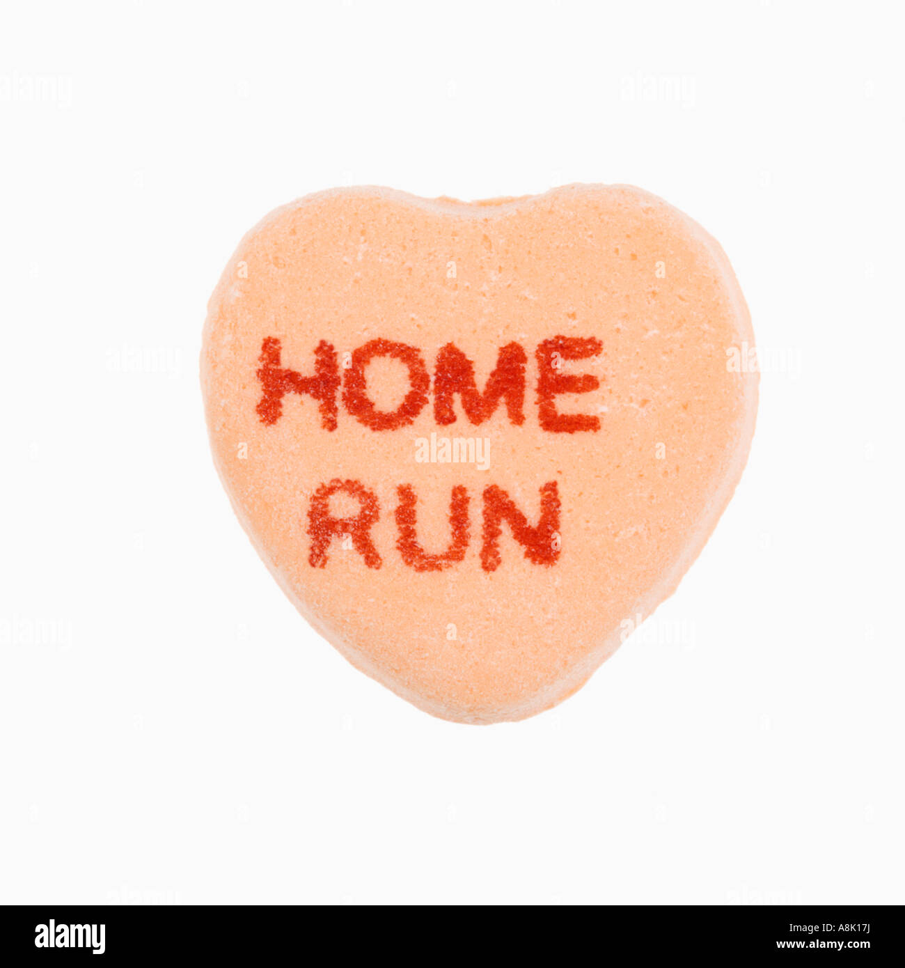 Orange candy heart that reads home run against white background Stock ...