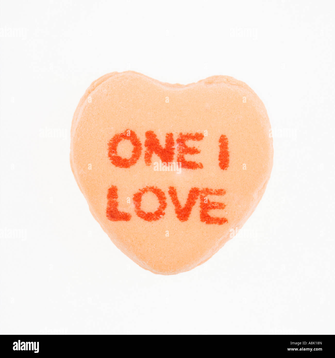 Orange candy heart that reads one I love against white background Stock ...