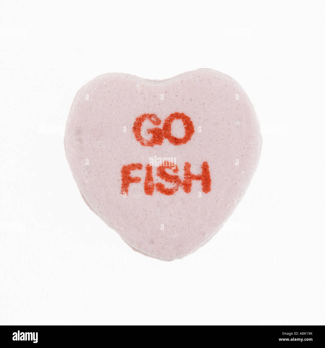 Purple candy heart that reads go fish against white background Stock ...
