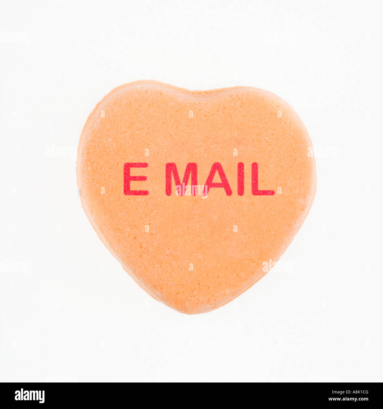 Orange candy heart that reads e mail against white background Stock ...
