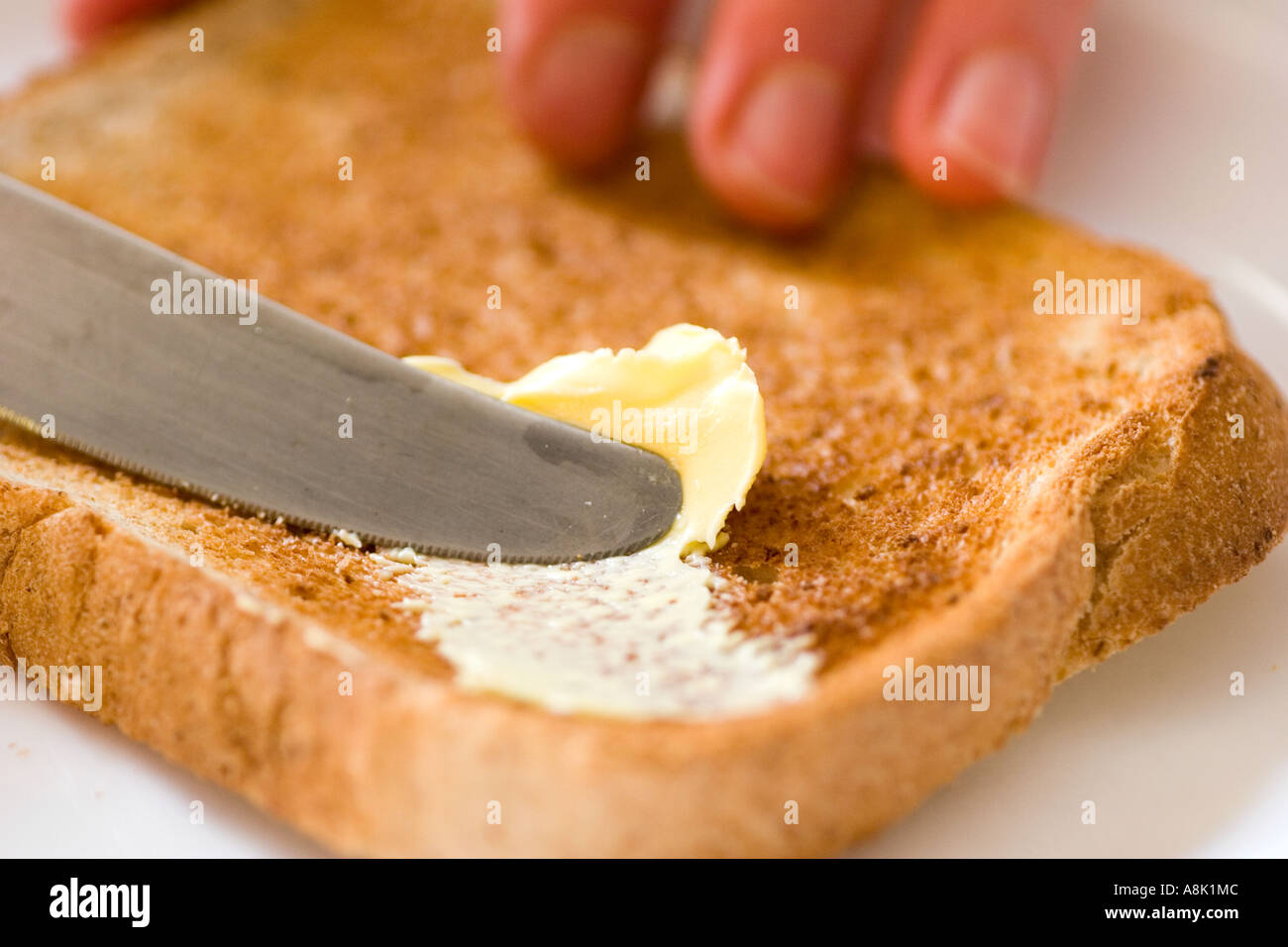 buttering toast Stock Photo: 6926347 - Alamy