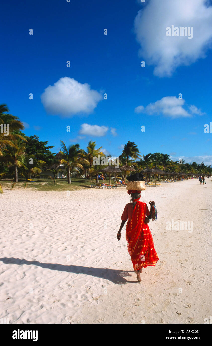 Africa Mauritius beach Mon choisy woman in red sari Stock Photo - Alamy