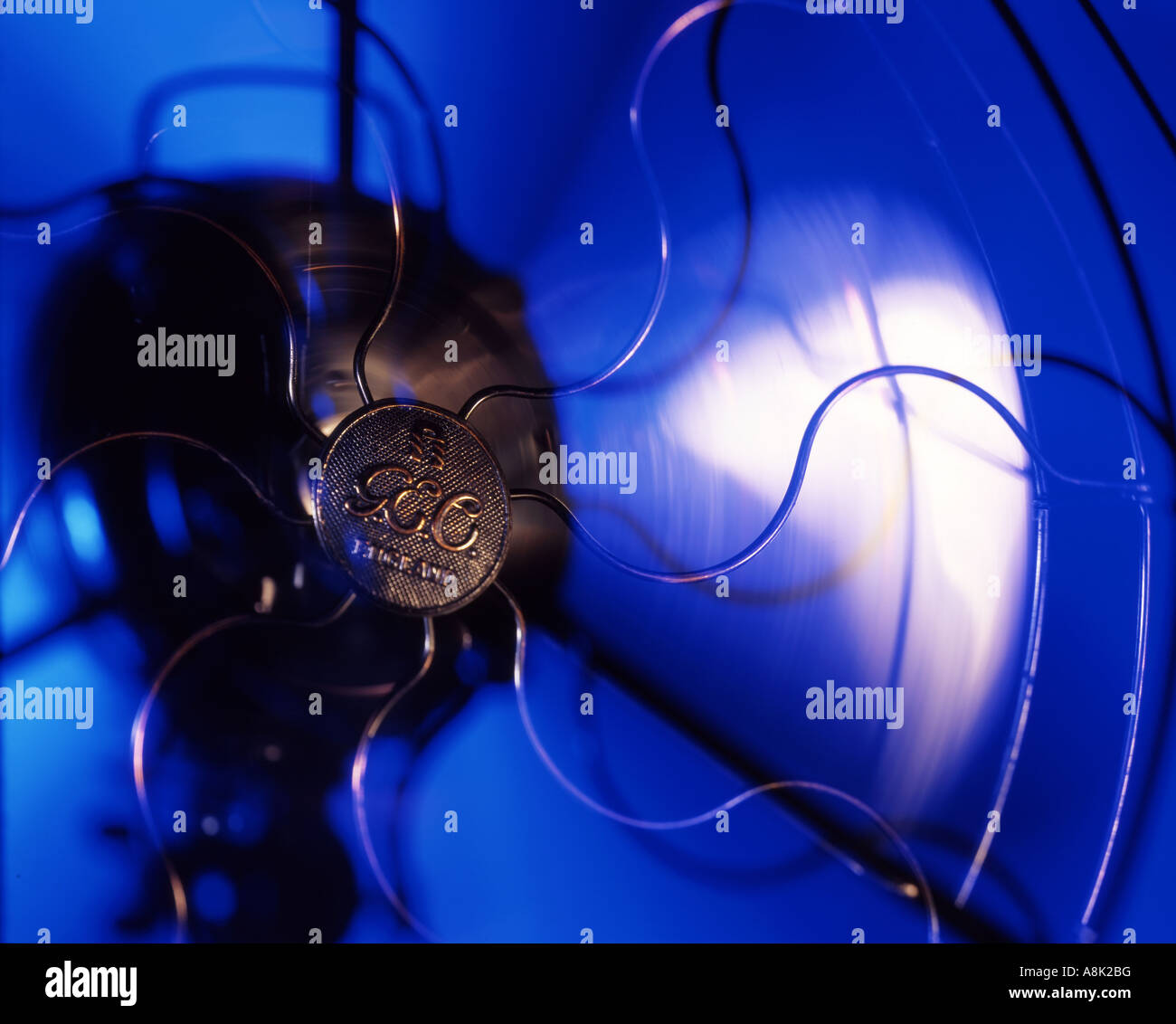 Antique fan spinning with blue atmospheric background Stock Photo - Alamy