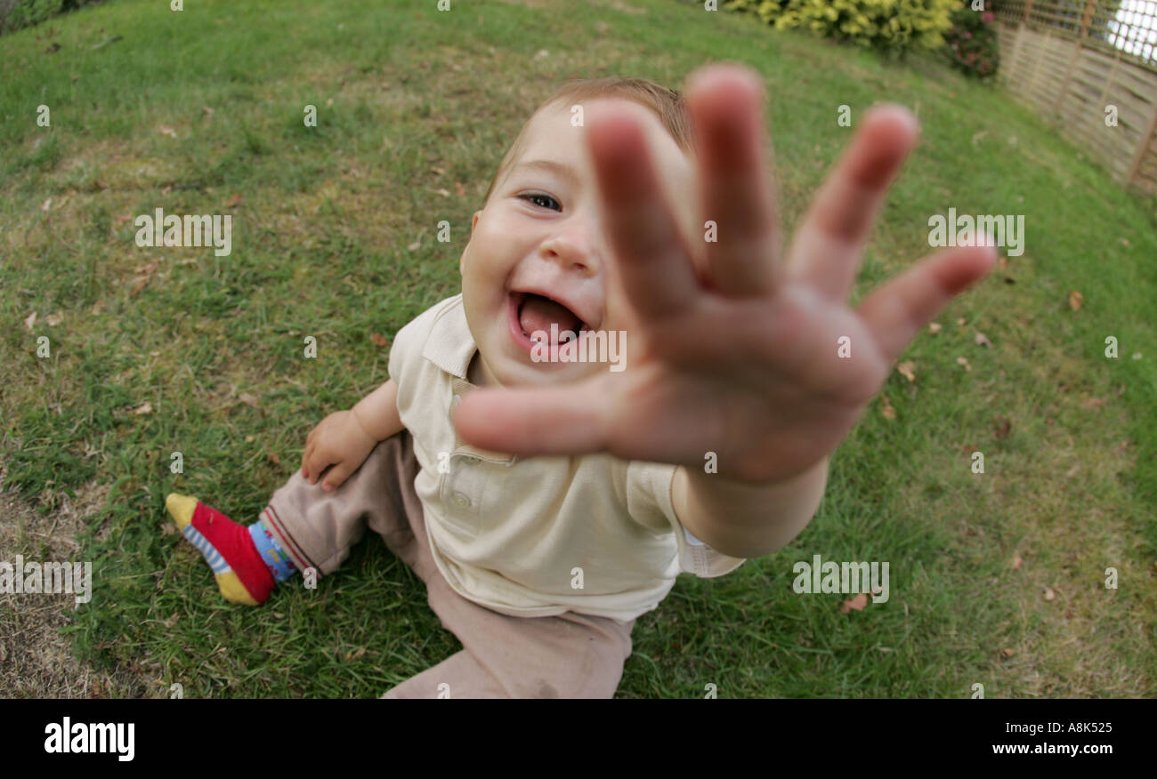 Baby boy reaching out hi-res stock photography and images - Alamy