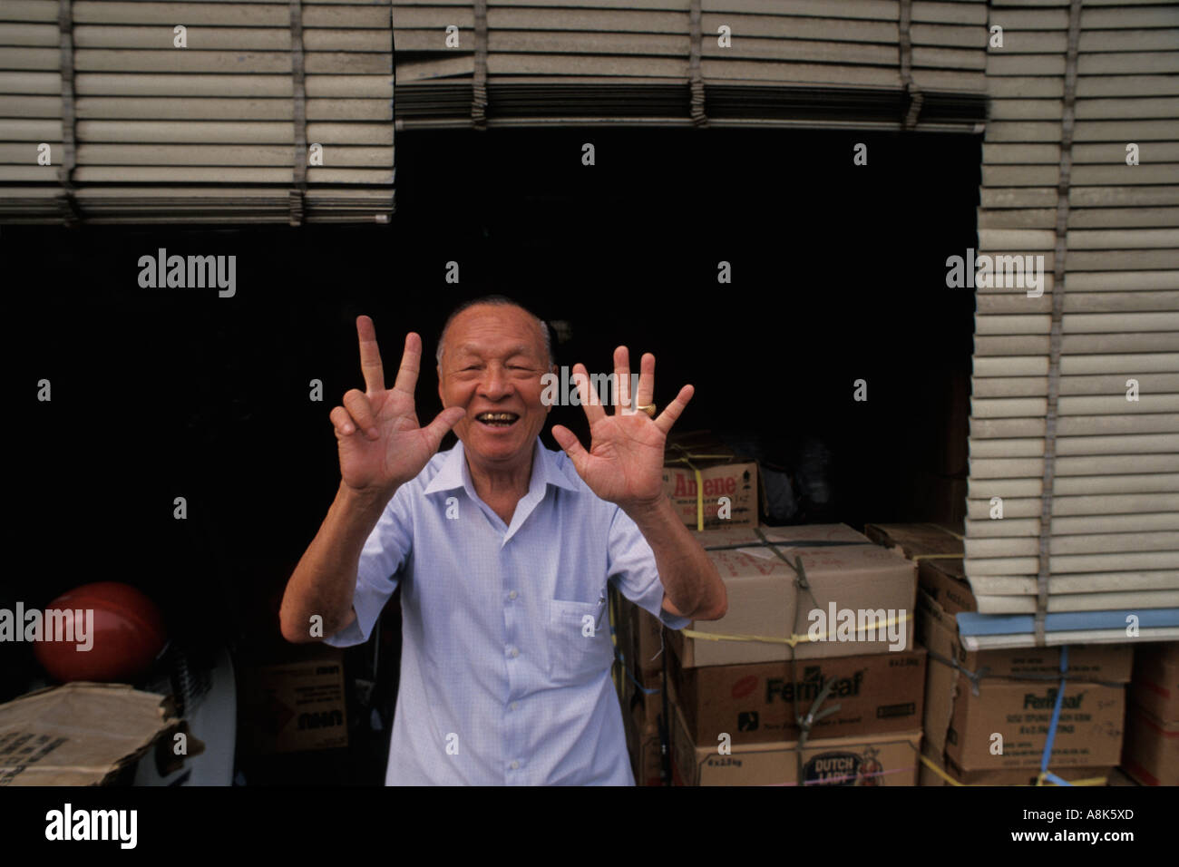 Malaysia, Malacca, Shopkeeper Stock Photo - Alamy