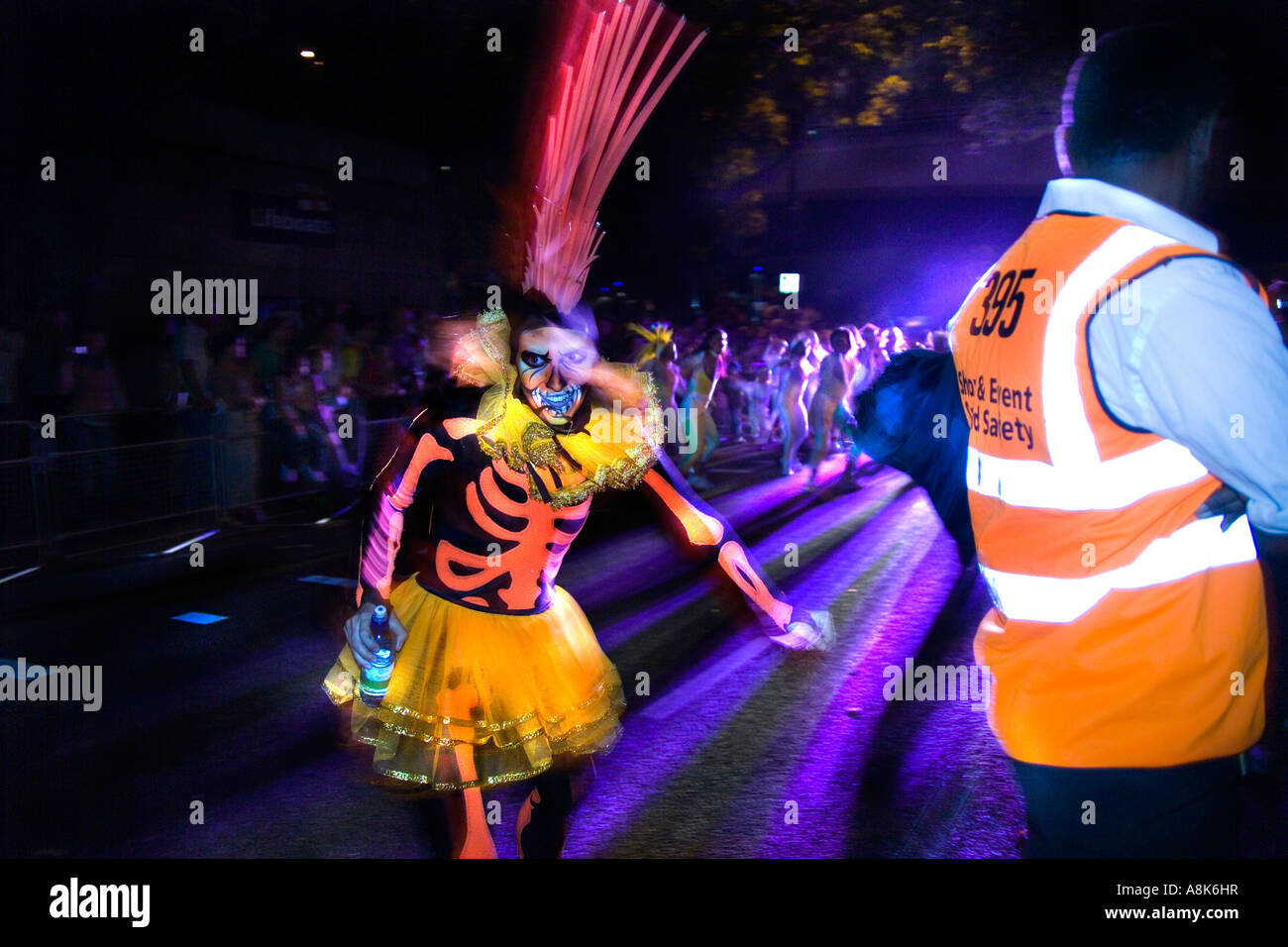 Night parade with security officer in neon jacket of the Festival of ...