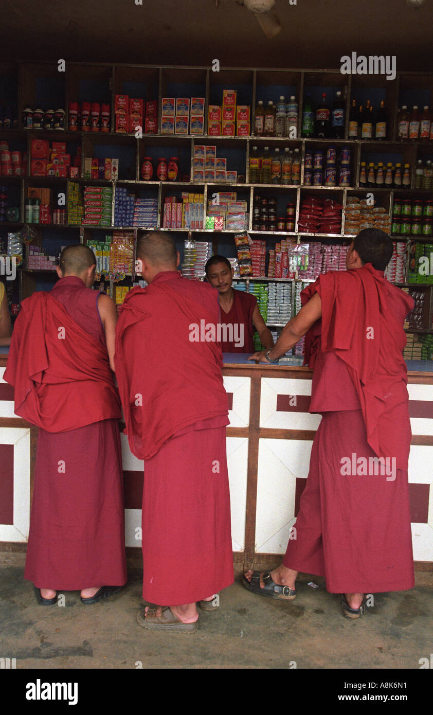 Tibetan monks shop in a store at the Drepung Gomang Monastery in India ...