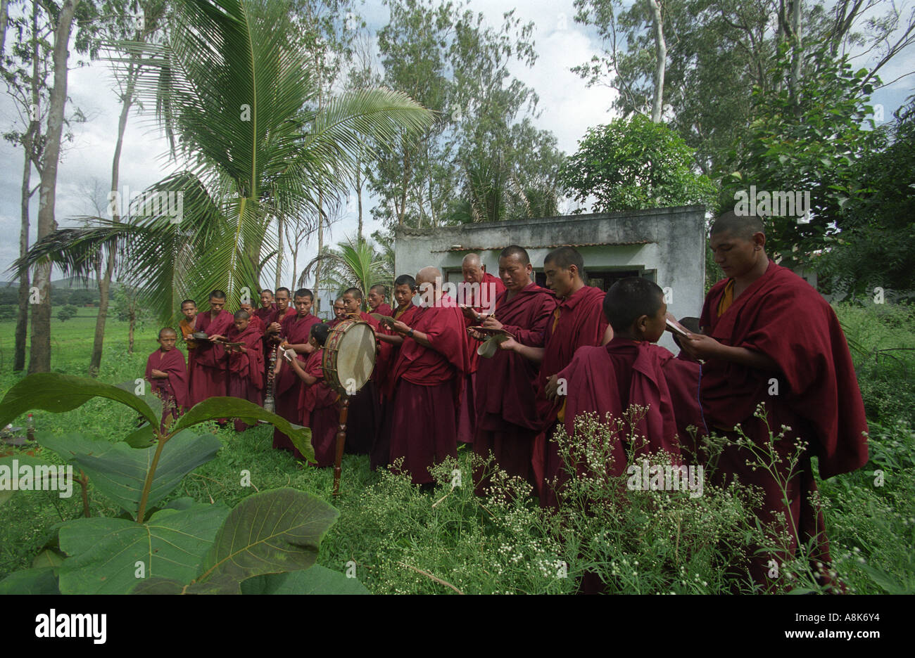 Tibetan Monks chant and play instruments during a prayer and fire puja ...