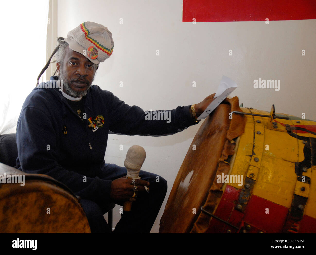 Rastafarian man playing drums in rasta Temple in Kennington South ...