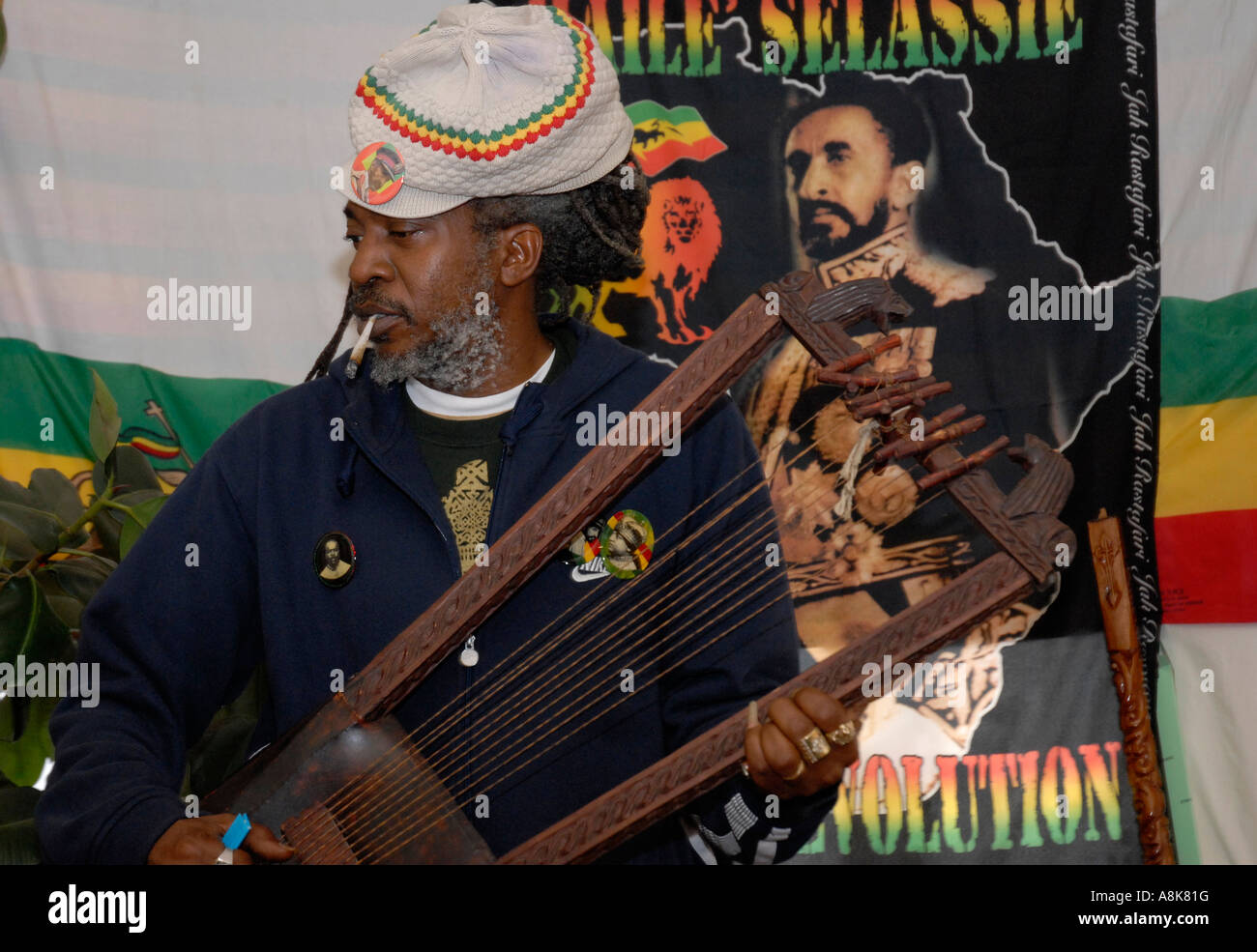 Rastafarian man playing traditional instrument in rasta Temple in ...