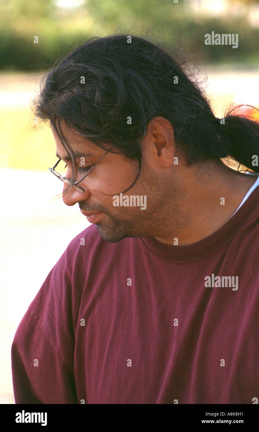 Thoughtful man age 32 at the Asian American Festival. St Paul Minnesota ...