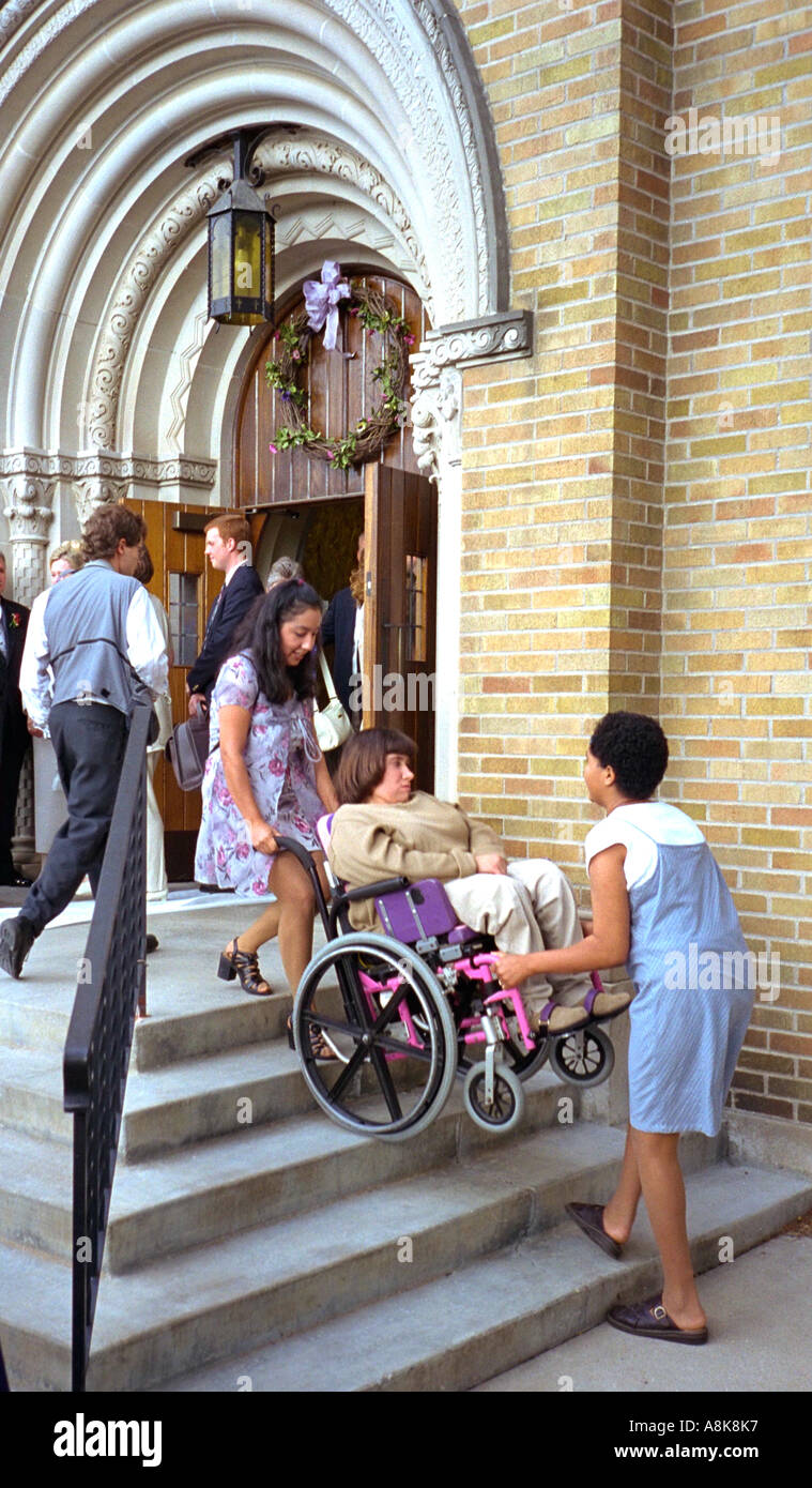 Handicapped women helped down church steps. No wheelchair access. Holy ...