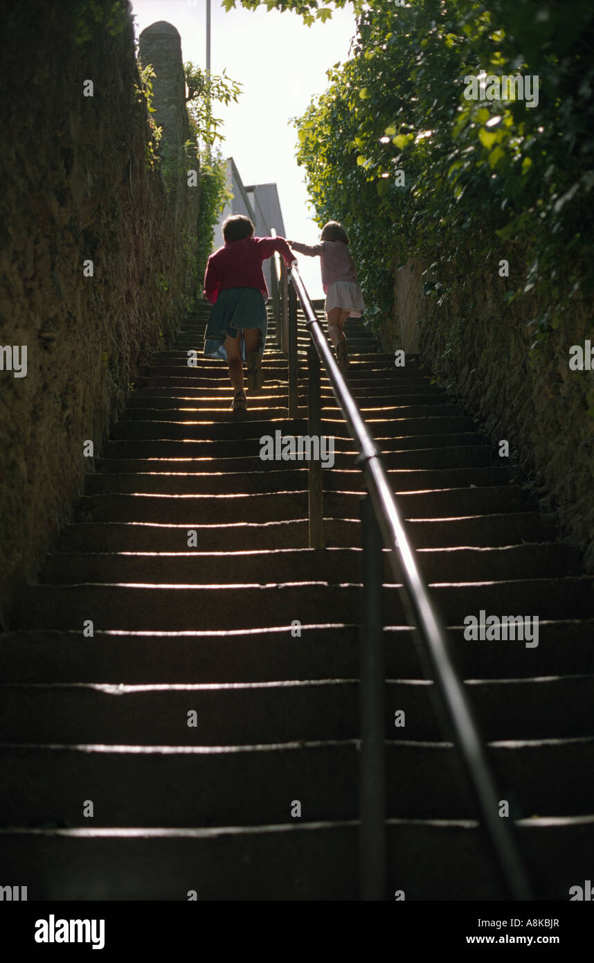 Girls walking up stairs hi-res stock photography and images - Alamy