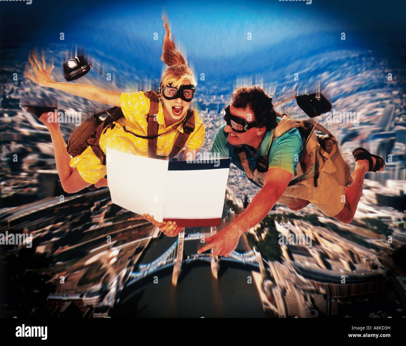Two people skydiving holding a paper Stock Photo - Alamy