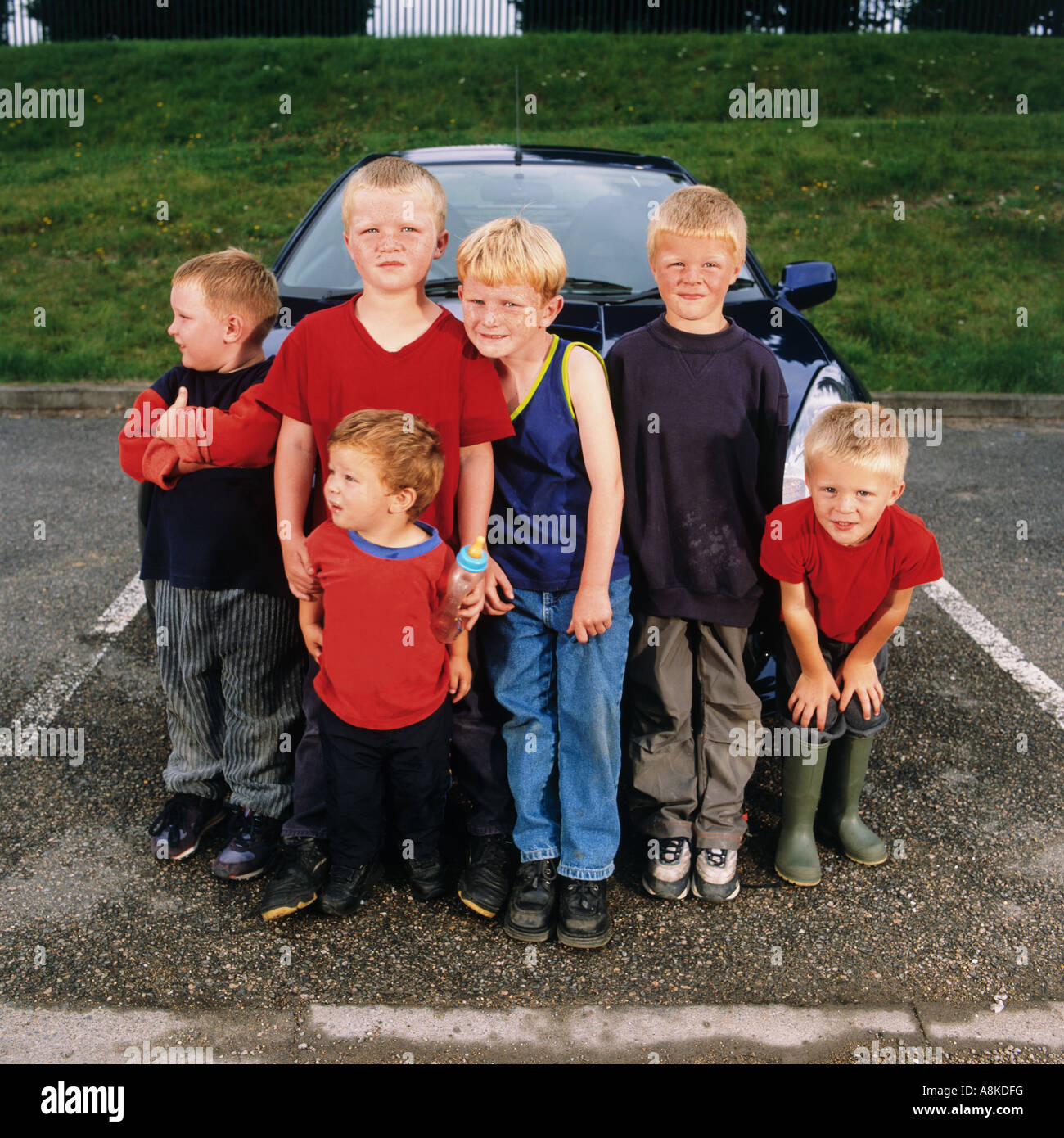 Children standing in front of a car Stock Photo - Alamy