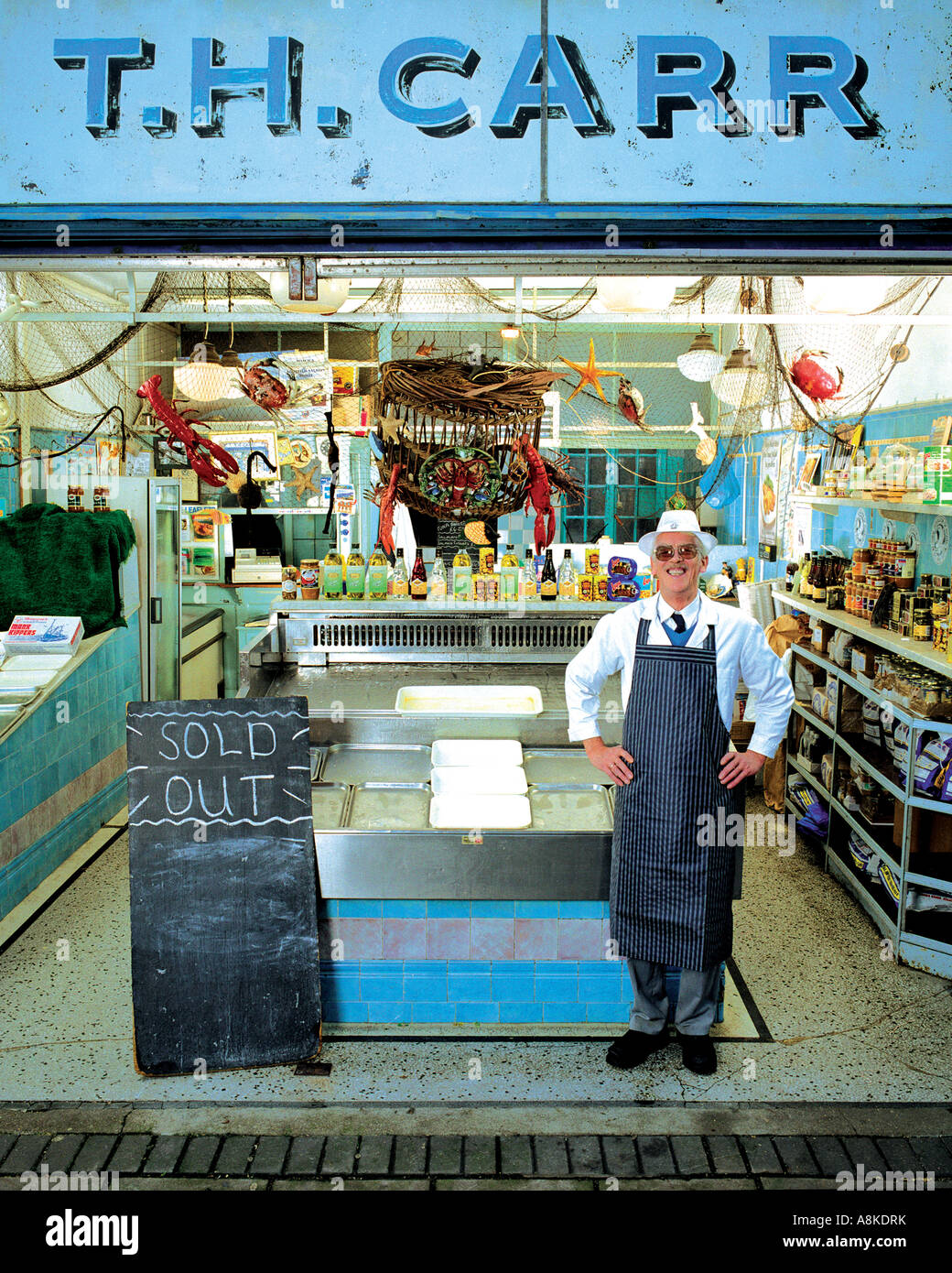 A butcher standing outside his shop Stock Photo - Alamy