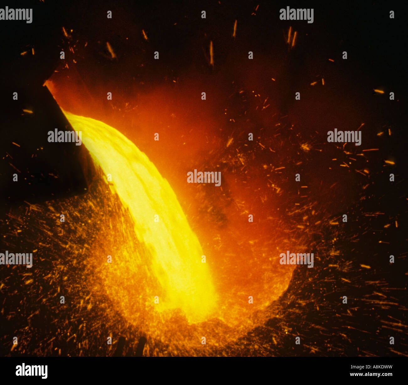 Molten metal steel being poured pouring into a Bessemer converter in a ...
