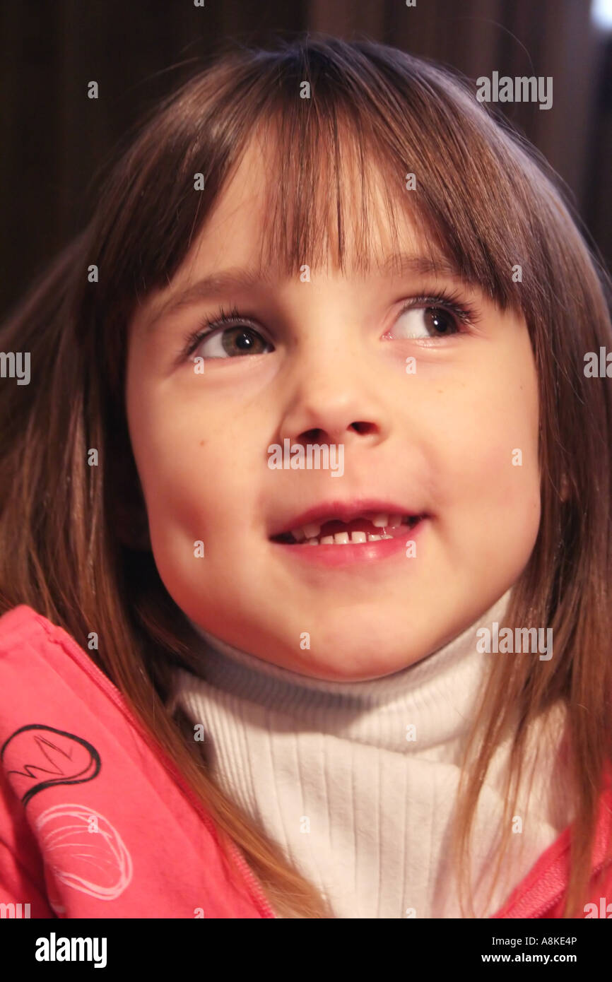 Cute child thinking and looking up and right Stock Photo - Alamy